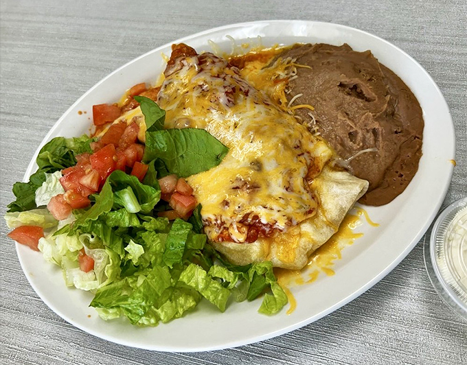 A breakfast burrito that means business, complete with melted cheese, fresh salsa, and refried beans. The morning wake-up call you deserve.