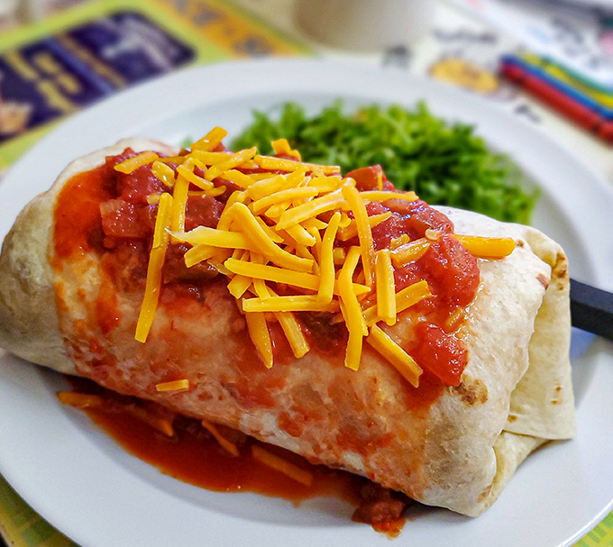 The breakfast burrito &ndash; where morning meets fiesta, topped with enough cheese to make Wisconsin nervous.