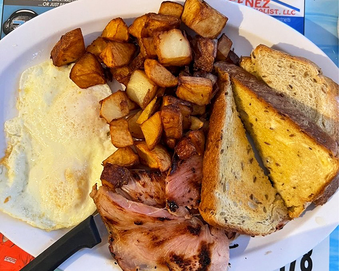 Breakfast that doesn't mess around&mdash;home fries crisped to perfection, eggs sunny as Florida itself, and ham that means business.