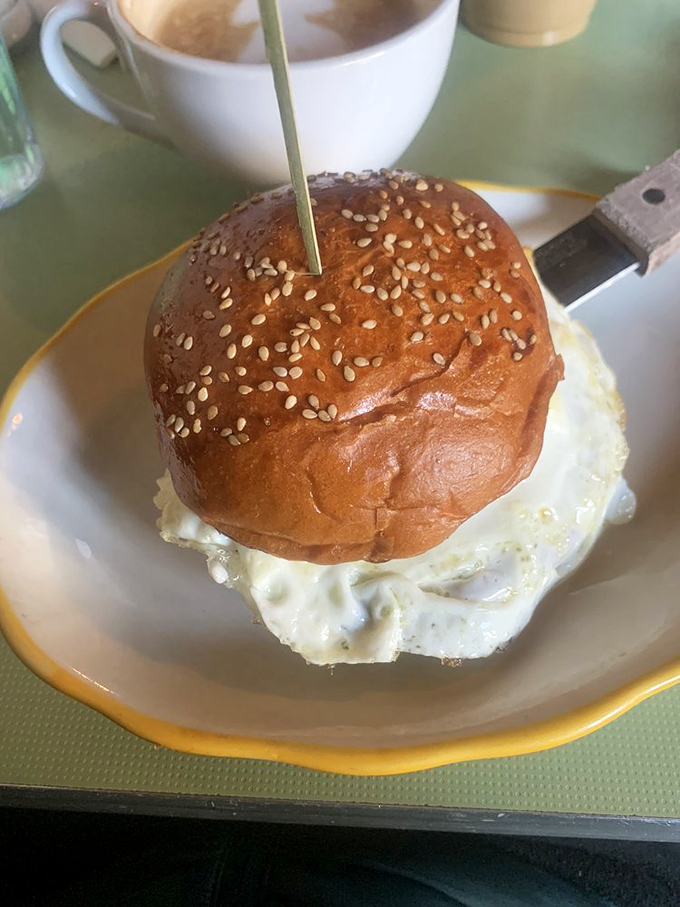 The breakfast sandwich that launched a thousand return visits. That sesame-studded bun cradles an egg with the confidence of a much fancier establishment.