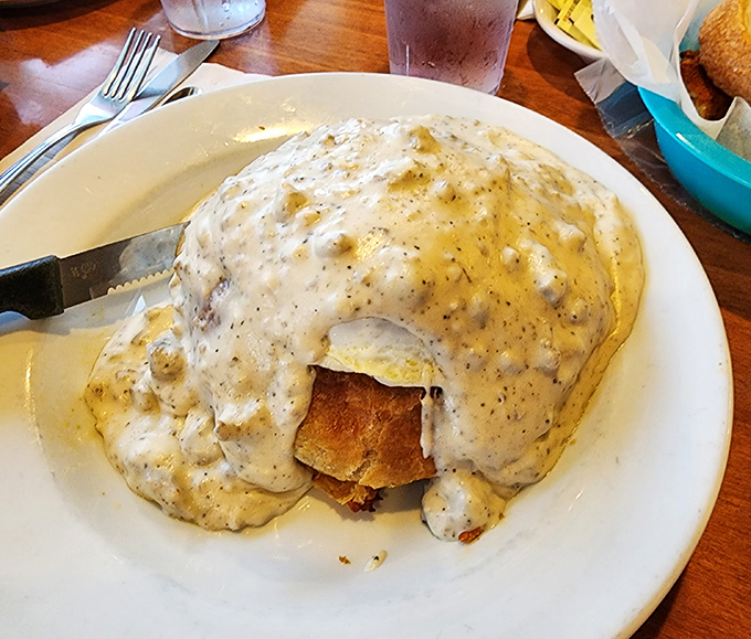 Breakfast goes formal with this gravy-blanketed masterpiece&mdash;like your favorite breakfast sandwich decided to dress up for the opera.