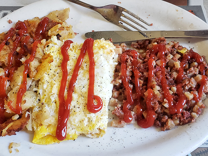 Breakfast architecture at its finest. The ketchup artistry adds a Jackson Pollock flair to this hearty plate of morning fuel.