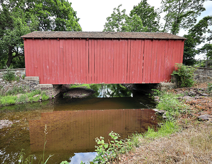 The side view reveals how the bridge's weathered red boards have developed a patina that no Instagram filter could ever replicate.