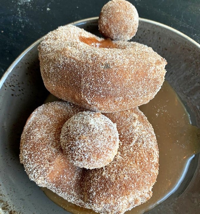 Brioche doughnuts bathed in cinnamon sugar and coffee caramel sauce. Proof that sometimes the simplest pleasures are the most profound.