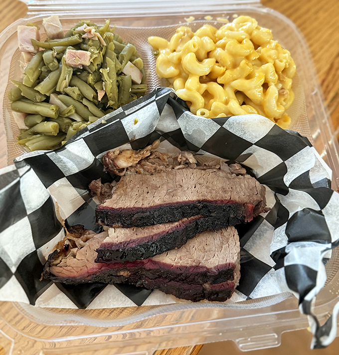 The brisket's bark is like nature's candy, paired with green beans and that legendary mac and cheese&mdash;a balanced meal if you squint hard enough.