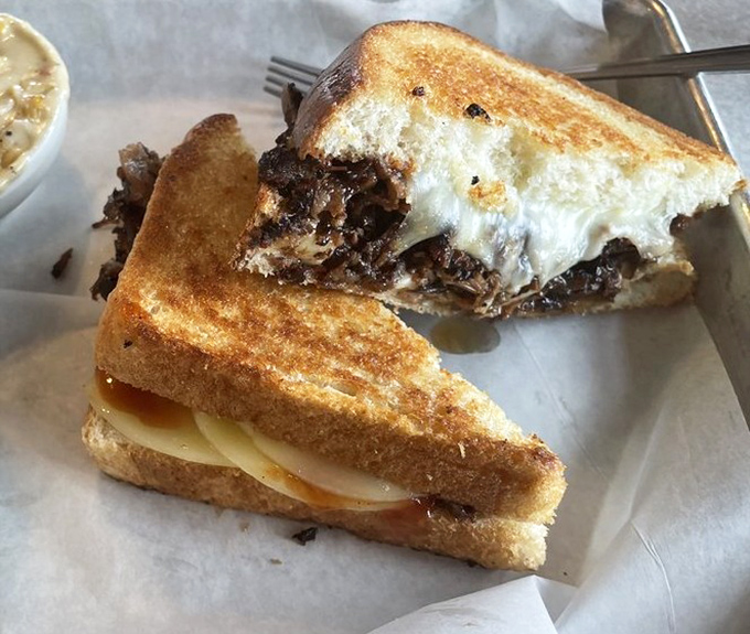 The grilled cheese grew up, went to college, and came back with smoked meat and melty perfection between toasty bread.