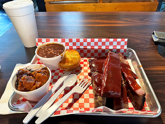 Enjoy a hearty, mouthwatering brisket platter served with classic sides and warm cornbread for a perfect, friendly Southern meal.