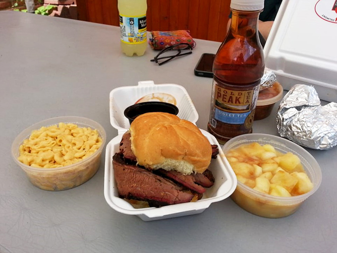 Brisket sandwich perfection with mac and cheese that looks like it could solve all of life's problems. The Gold Peak tea is just the cherry on top.