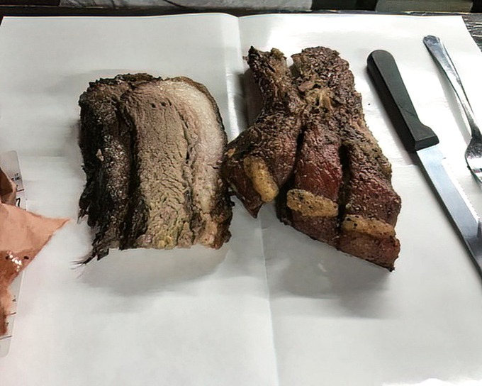 Brisket so tender it practically surrenders to your fork, alongside ribs that would make Fred Flintstone weep with joy.