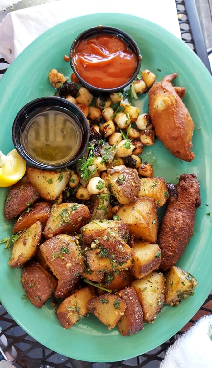 This isn't just a plate&mdash;it's a treasure map of flavors with potatoes, scallops, and dipping sauces that'll have you plotting your return visit.