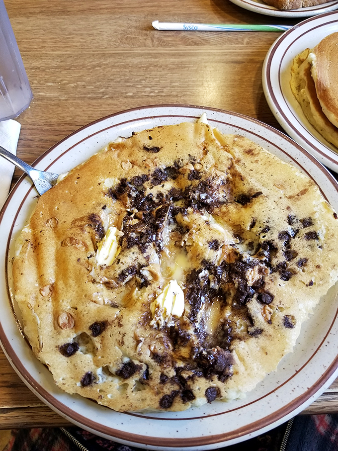 Chocolate chip pancakes that make you question why anyone bothers with fancy brunch. Melted butter pools in the center like nature intended.