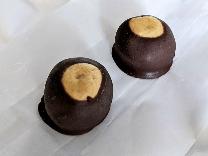 These chocolate-dipped buckeyes prove that Ohio knows how to turn simple peanut butter into edible art that would make Willy Wonka jealous.