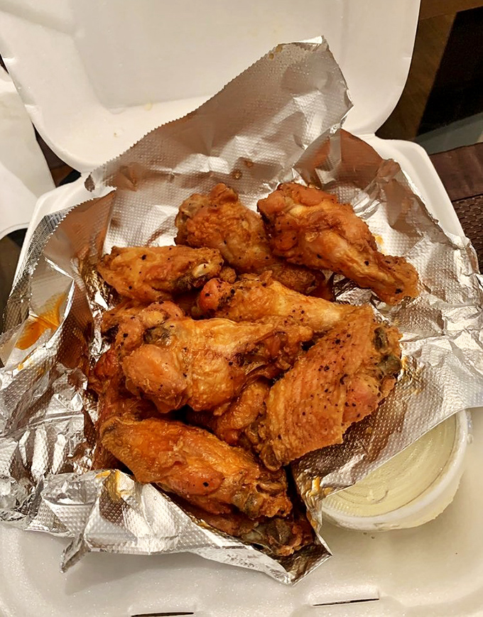 Golden-fried wings that could make Buffalo natives nod in approval—crispy on the outside, juicy within, and served with that essential side of cooling ranch.