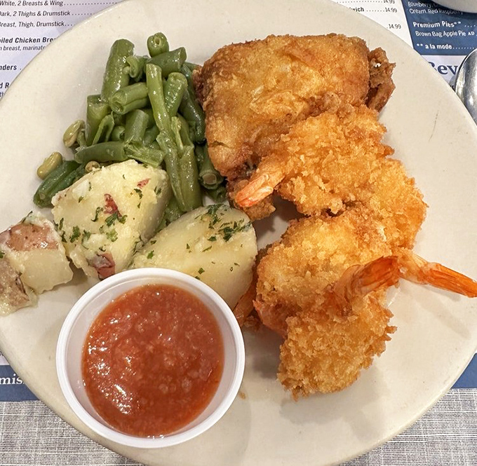 Golden-fried perfection meets garden-fresh green beans on a buffet platter that doesn’t just feed you—it hugs you from the inside out.