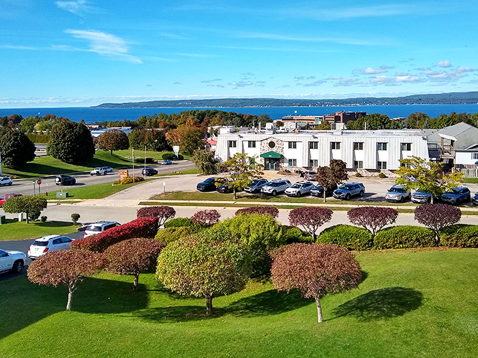 Autumn colors frame this lakeside view, where Michigan's natural splendor meets comfortable accommodations in perfect harmony.
