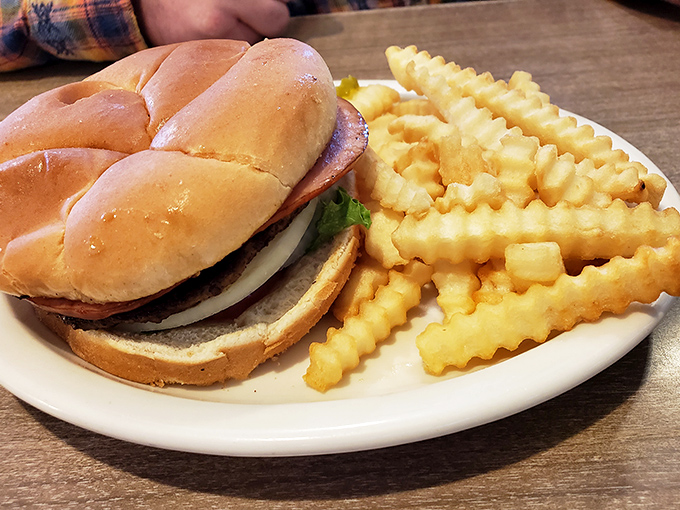 A proper diner burger doesn't need aioli or brioche to impress. Just a well-seasoned patty, fresh toppings, and those crinkle-cut fries that taste like childhood.