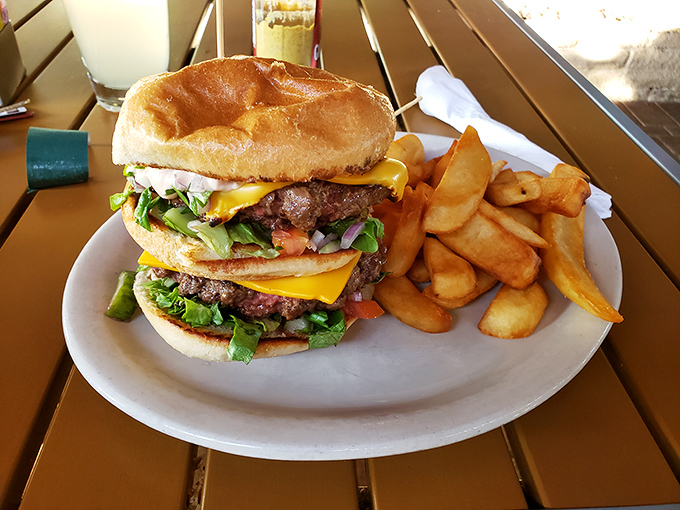 Burger architecture at its finest. This towering creation demands both your attention and a strategy for how to fit it in your mouth.