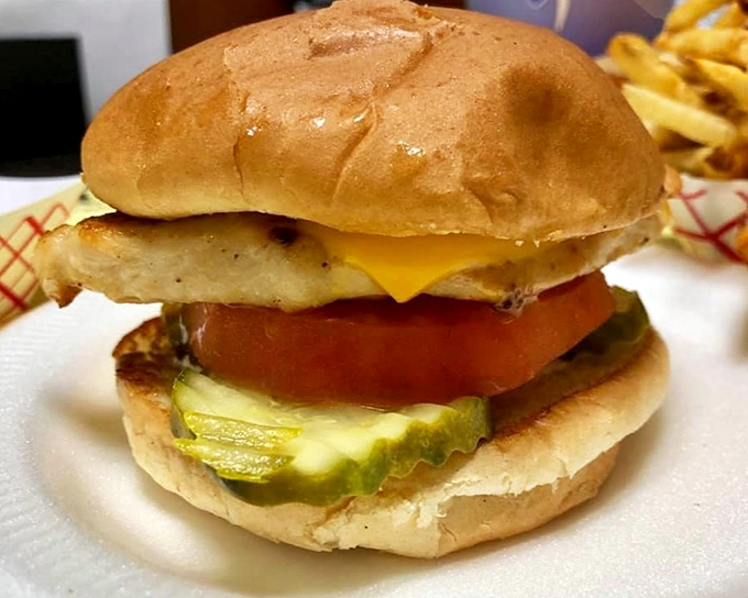 This isn't just a burger&mdash;it's edible nostalgia. The perfect ratio of beef, cheese, pickle, and tomato creates a harmony that fancy $20 burgers often miss entirely.