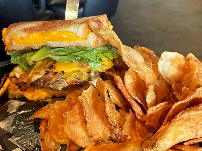Behold the burger that launched a thousand cravings, complete with homemade chips that shatter with satisfying crispness.