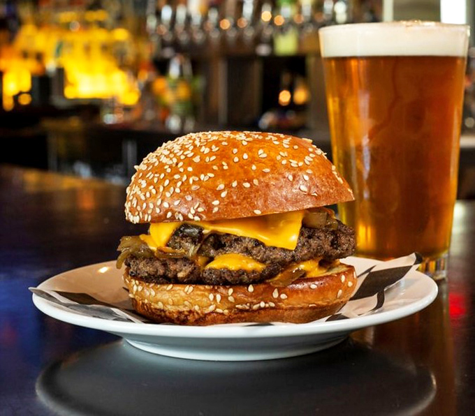 This isn't just a burger&mdash;it's a masterpiece of beef, cheese, and sesame-studded bun that pairs perfectly with that amber pint of liquid happiness.