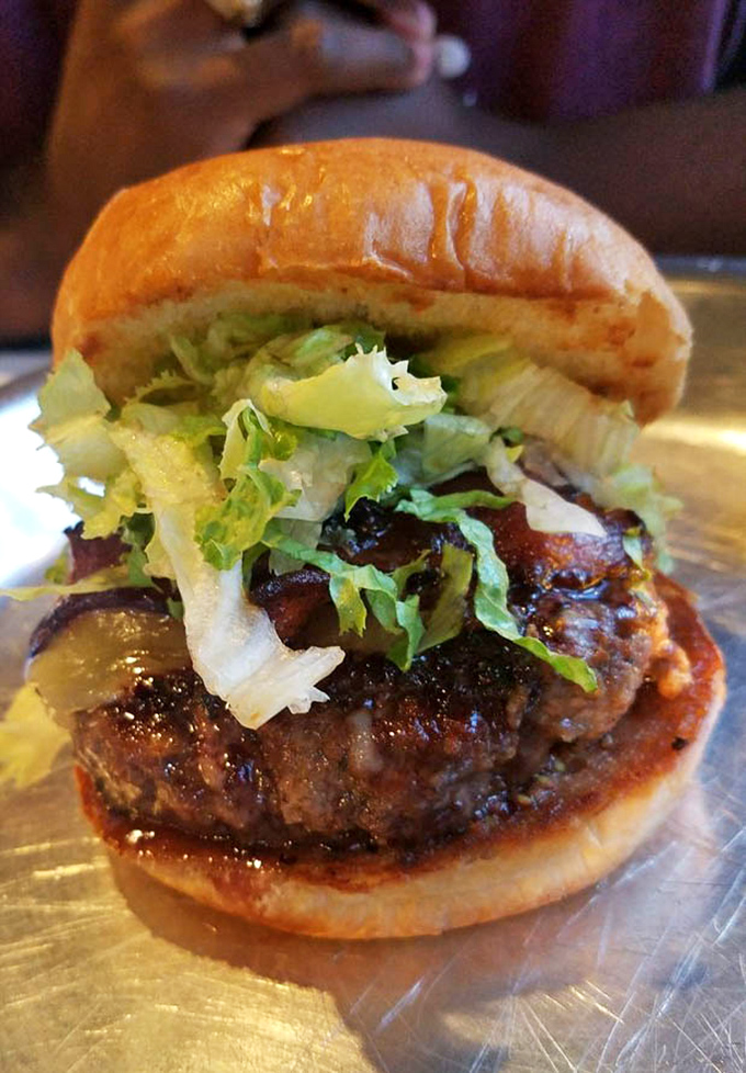 Every burger here is a masterpiece of creative construction, proving that sometimes crazy combinations create pure magic.