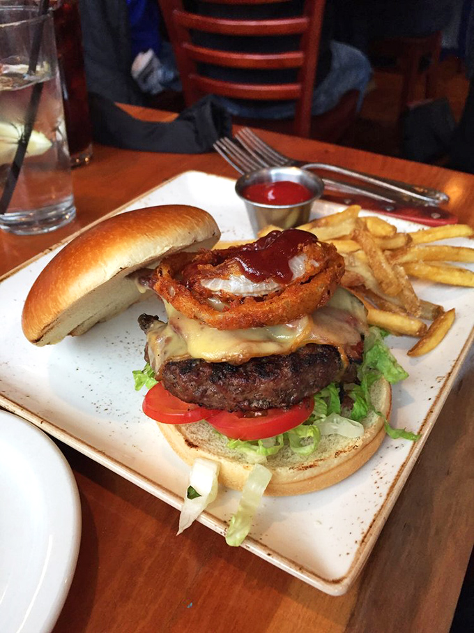 This burger towers like a delicious monument to everything right about American comfort food done properly.