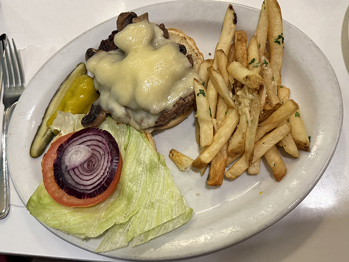 A burger that requires both hands and a strategy. The melted cheese isn't just a topping&mdash;it's a commitment to excellence.