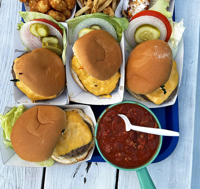 Burger democracy in action: four perfectly crafted cheeseburgers with Grandma's homemade chili standing by for moral support.