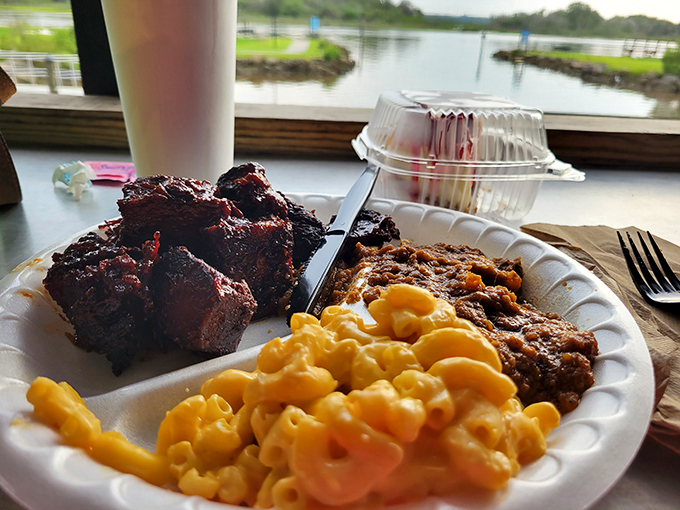 Nature's perfect food: burnt ends with mac and cheese and baked beans. The waterway view through the window suggests you've found heaven on Florida's east coast.