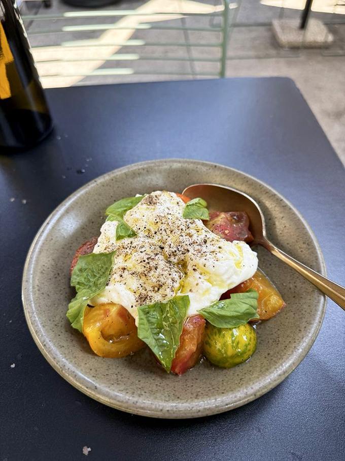 The burrata salad&mdash;where fresh cheese meets heirloom tomatoes in a summer romance so perfect it deserves its own Italian love song.