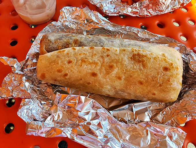 This isn't just a burrito&mdash;it's a masterclass in tortilla engineering. Golden-brown, perfectly sealed, and promising treasures within its foil fortress.