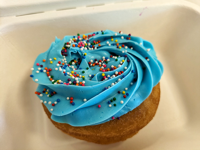 Blue buttercream swirled to perfection and topped with rainbow sprinkles&mdash;this donut doesn't just taste like happiness, it looks like the celebration itself.