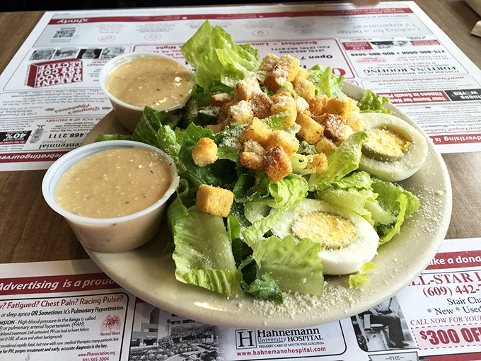 A Caesar salad done right&mdash;crisp romaine, generous Parmesan, and house-made croutons that crackle with each bite. Simple perfection on a plate.