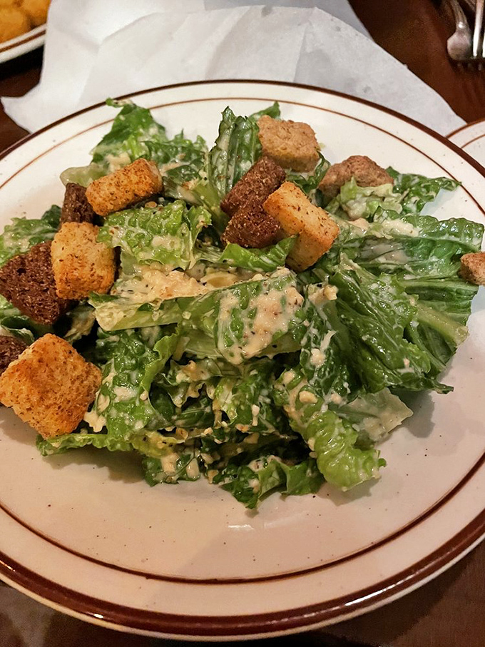 A Caesar salad that Julius himself would approve – crisp romaine, golden croutons, and dressing that makes you forget you're eating something green.