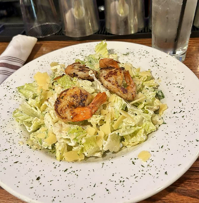 Caesar salad elevated to new heights with perfectly seared shrimp that could make even landlubbers swoon with delight.