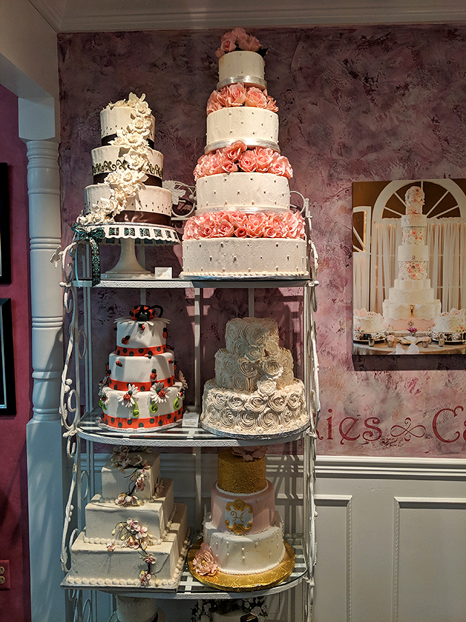 Wedding cake display that proves love is patient, love is kind, and love absolutely requires multiple tiers of frosting artistry.