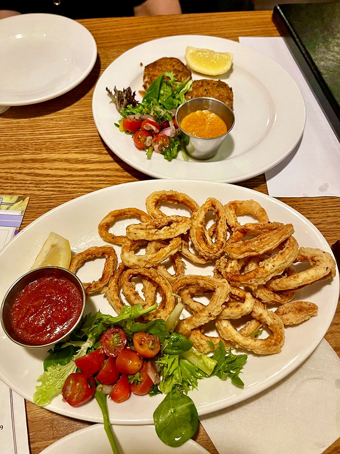 Crispy calamari rings that crunch like nature's perfect onion rings, with a marinara sauce worth bottling and taking home.