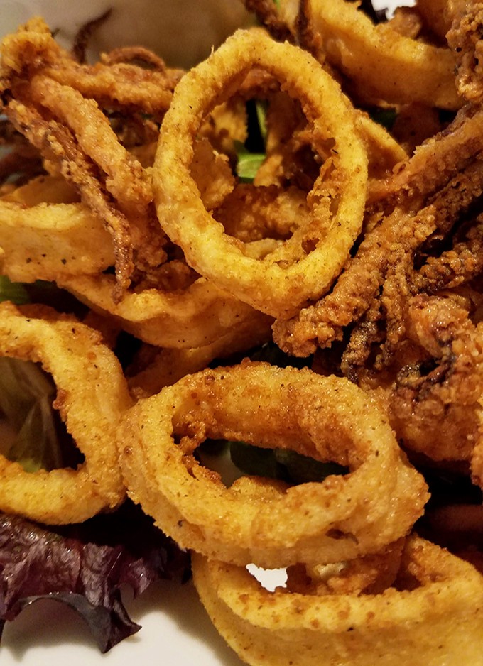 Crispy calamari rings stacked like delicious golden halos. The perfect starter for sharing, if you're feeling generous (which I rarely am).