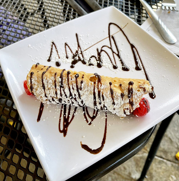 The cannoli&mdash;Sicily's gift to the world. Crisp shell, sweet filling, and chocolate drizzle that makes you want to leave the gun, take the cannoli.
