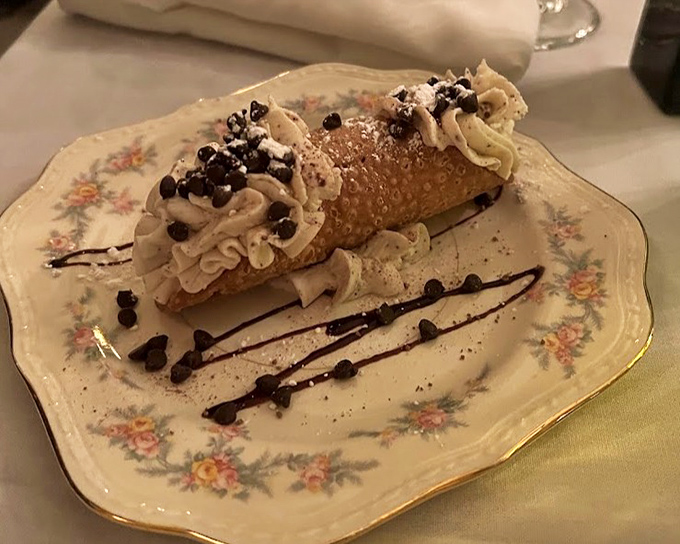 This cannoli isn't just dessert, it's architecture&mdash;a crisp shell fortress protecting creamy ricotta treasure, with chocolate chips standing guard at both ends.
