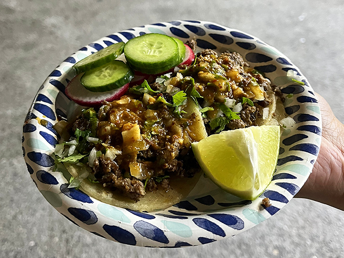 Simplicity perfected: fresh lime, crisp vegetables, and perfectly seasoned meat create the holy trinity of street taco perfection.