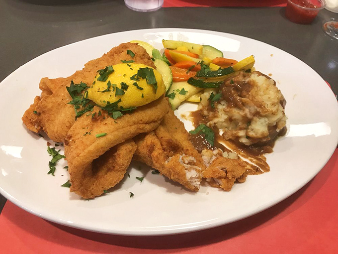 This isn't just fried fish&mdash;it's aquatic perfection with a crispy passport. Those vegetables aren't just sides; they're colorful co-stars in this plate production.