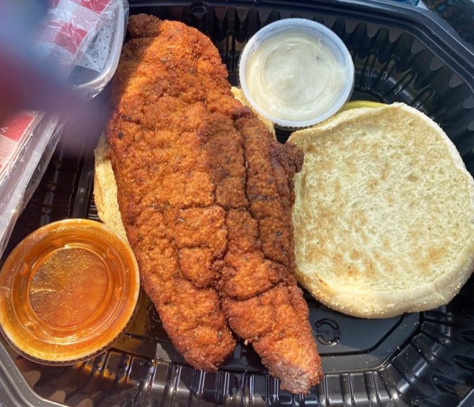This isn't just a fish sandwich&mdash;it's a masterpiece of crispy, golden-brown catfish that's had a perfect spa treatment in seasoned breading before meeting its destiny on a soft bun.