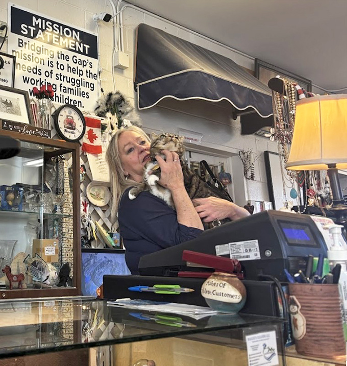 Even the store's mission statement gets a furry endorsement—community service with a side of cuddles.