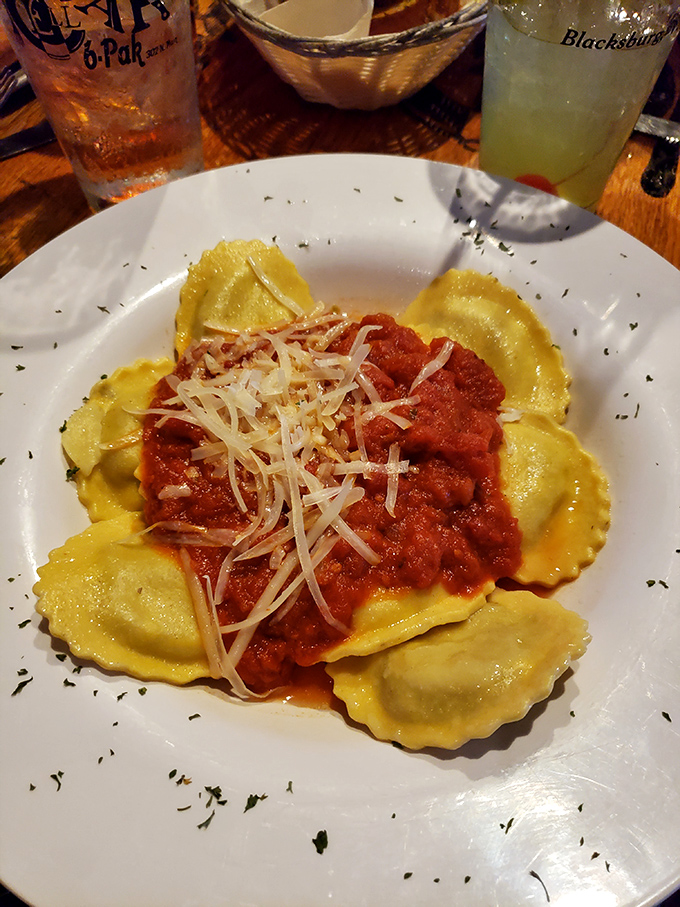 Ravioli islands floating in a sea of robust tomato sauce &ndash; pasta pillows that comfort your soul while challenging your restraint.