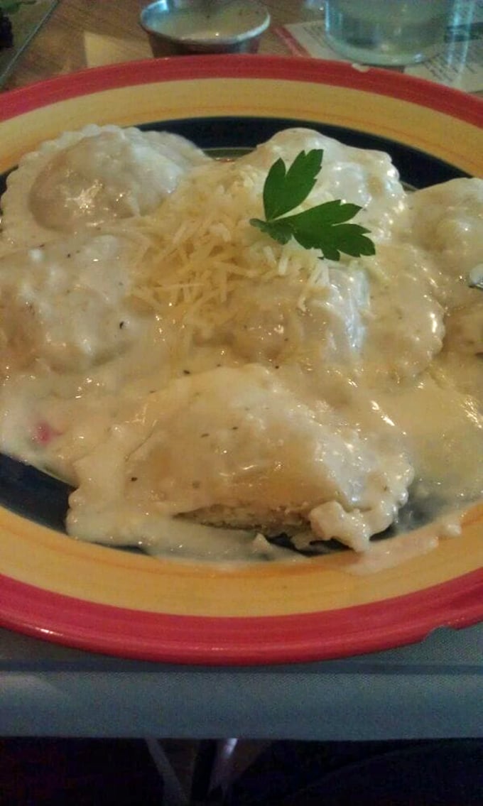 Cheese ravioli bathed in cream sauce and topped with a sprig of parsley—like little pillows of joy having a spa day.