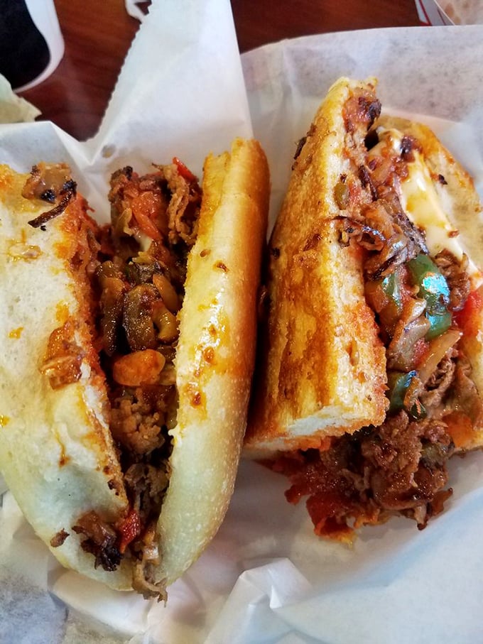 The cheese steak that launched a thousand napkins. This glorious mess demands two hands, zero shame, and possibly a post-sandwich nap.
