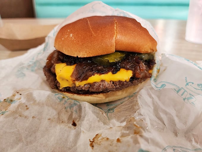 This isn't just a cheeseburger; it's a masterclass in American comfort food &ndash; melty cheese cascading over a perfectly seared patty.