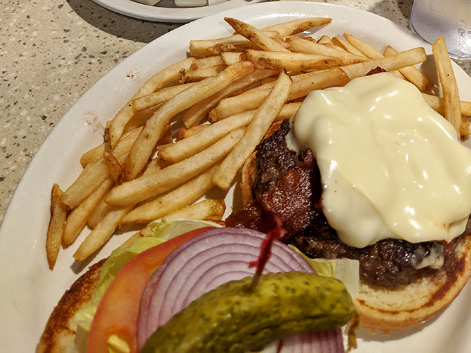 A cheeseburger that doesn't need fancy aioli or artisanal buns to make its point &ndash; just honest beef, melted cheese, and the promise of satisfaction.