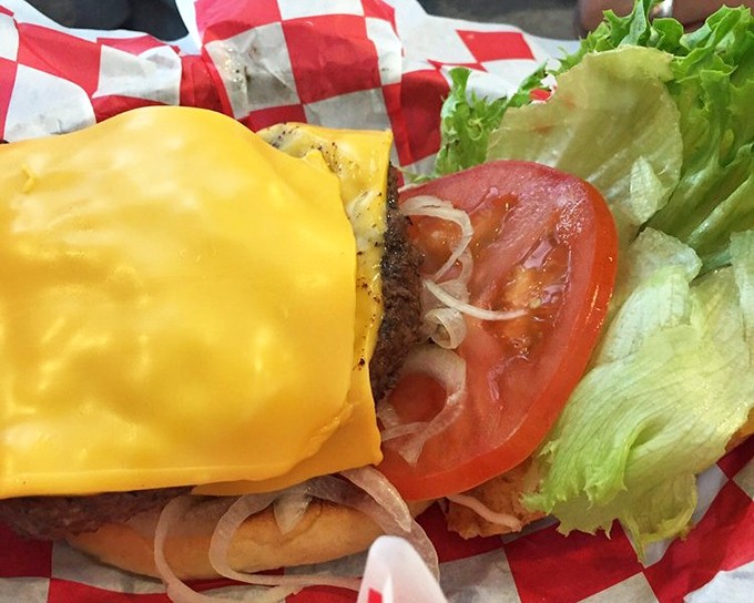 When a burger wears cheese like a golden crown and sits on a perfectly toasted bun, you know you're in the presence of fast-food royalty.